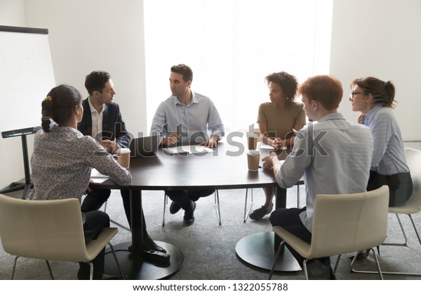 Businessmen Talking Discussing Business Project At Multi Ethnic Board