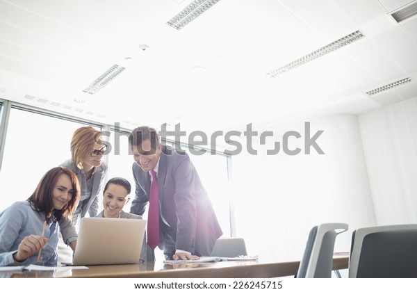 Businesspeople Using Laptop Conference Table Stock Photo 226245715 ... Businesspeople Using Laptop Conference Table Stock Photo 226245715 ...