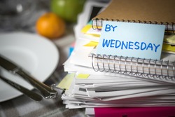 Stacked documents on your desk containing english, wednesday, and break ...