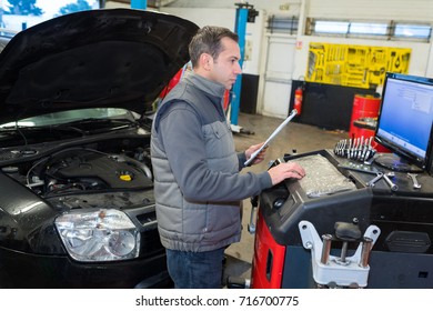 Car Mechanic Using Computer Stock Photo 716700775 | Shutterstock
