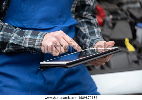 Car Mechanic Using Digital Tablet Checking Stock Photo (Edit Now ...
