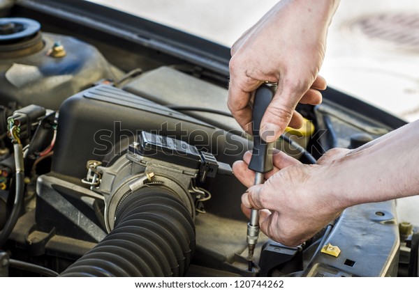 Car Mechanic Working Under Engine Hood Stock Photo (Edit Now) 120744262