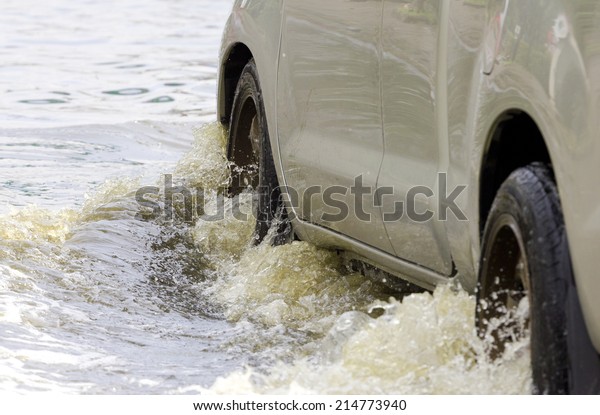 Car Splashes Through Large Puddle On Stock Photo 214773940 | Shutterstock