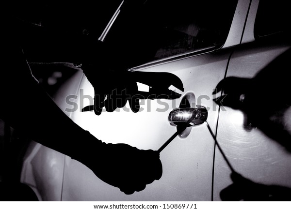 Car Thief Using Tool Break Into Foto stock 150869771 | Shutterstock