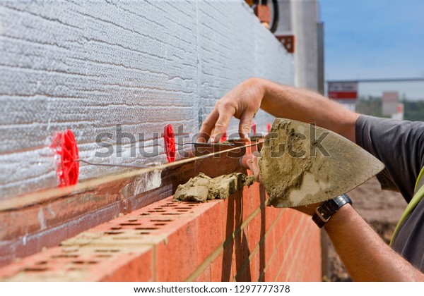 Close Bricklayer Laying Brick Wall On Stock Photo 1297777378 | Shutterstock