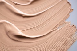 Close up texture of liquid featuring foundation, makeup, and texture, a ...