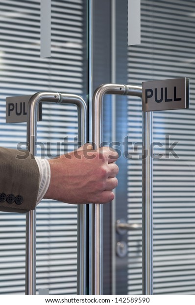 Close Hand Pulling Open Office Door Stock Photo (Edit Now) 142589590