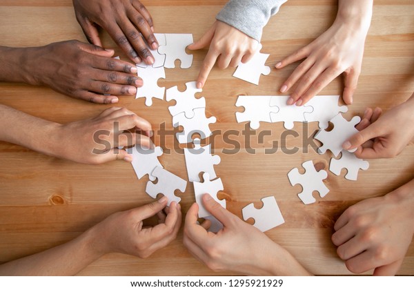 Close Multiracial People Team Assembling Puzzle Stock Photo (Edit Now ...