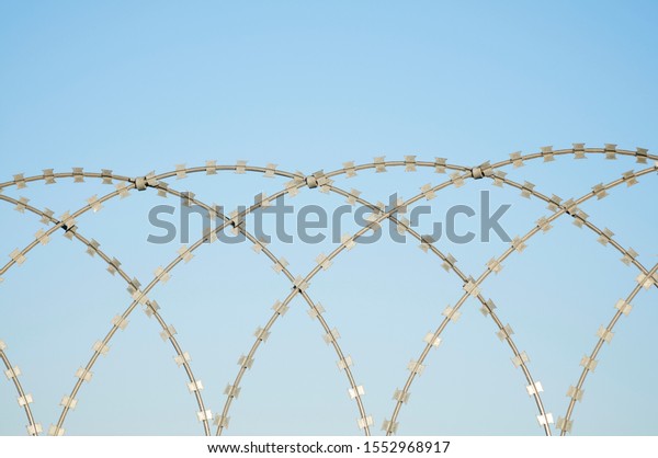 Close Sharp Razor Wire Fence Curving Stock Photo 1552968917 | Shutterstock