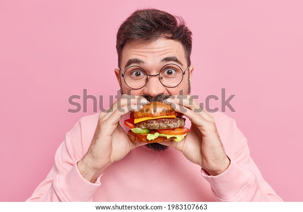 Close Shot Young Man Eats Greedily Stock Photo 1983107663 | Shutterstock
