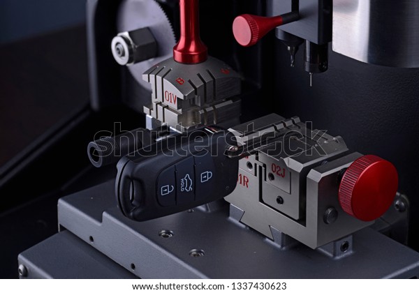Close view of key copying machine with key. Duplicate machine make new ...