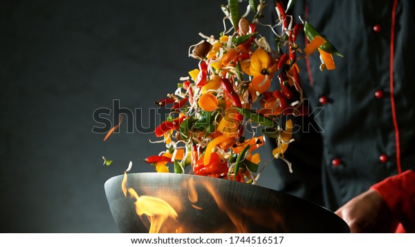 Closeup Chef Throwing Vegetable Mix Wok Stock Photo (Edit Now) 1744516517