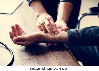 Closeup Hand Checking Another Pulse On Stock Photo (Edit Now) 1077531164