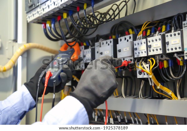 Close-up hand of electrical engineering using measuring equipment tool ...