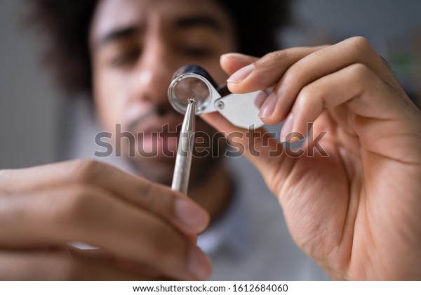 Closeup Persons Hand Checking Diamond Through Stock Photo (Edit Now ...