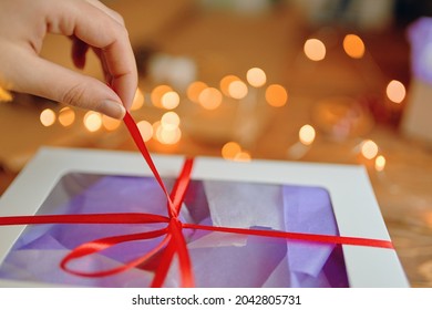 Closeup Persons Hand Pulling Red Ribbon Stock Photo 2042805731 ...