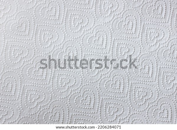 Closeup view of embossed surface texture of new white paper towel ...