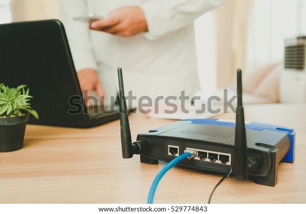 Closeup Wireless Router Man Using Laptop Stock Photo (Edit Now) 529774843