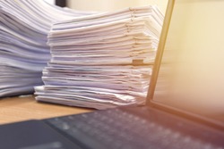 Documents on desk stack up high featuring document, desk, and pile, a ...
