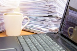Documents on desk stack up high featuring document, desk, and pile, a ...
