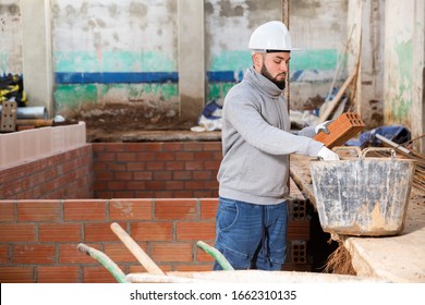 Confident Young Builder Working Red Brick Stock Photo (Edit Now) 1662310135