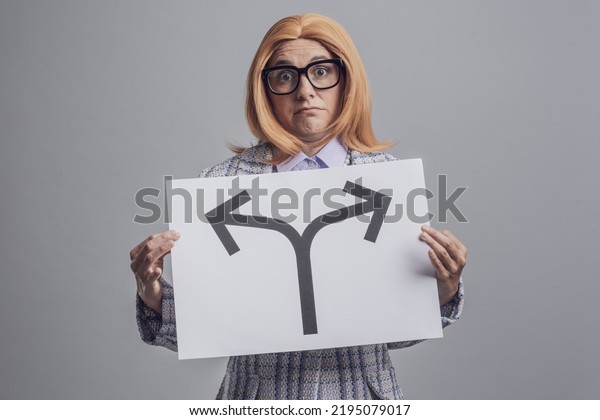 Confused Businesswoman Holding Sign Split Arrows Stock Photo 2195079017 ... Confused Businesswoman Holding Sign Split Arrows Stock Photo 2195079017 ...