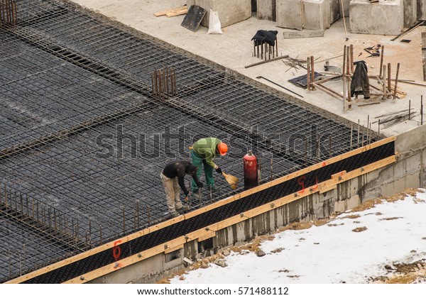 Construction Builders Working Together Positioning Concrete Stock Photo ...