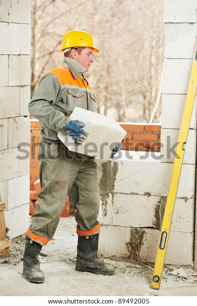 Construction Mason Worker Bricklayer Lifting Installing Stock Photo ...