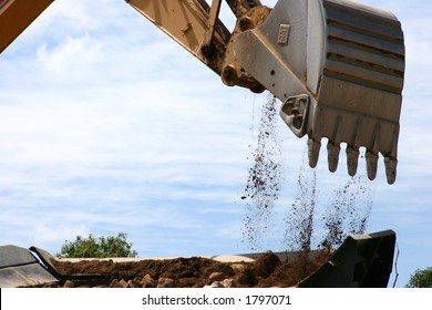 Construction Site Machine Digging Dirt Into Stock Photo 1797071 ...