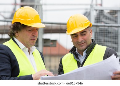 Construction Site Managers Showing Explaining Blueprints Stock Photo ...