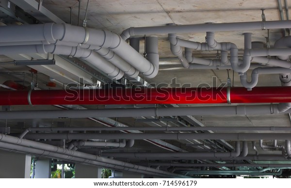 Construction work. Water pipe system. System of gray sanitary pipes in ...