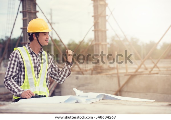 Construction Worker Checking Blueprints On Site Stock Photo 548684269 ...