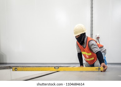 Construction Worker Checking Level Floor By Stock Photo 1104684614 ...