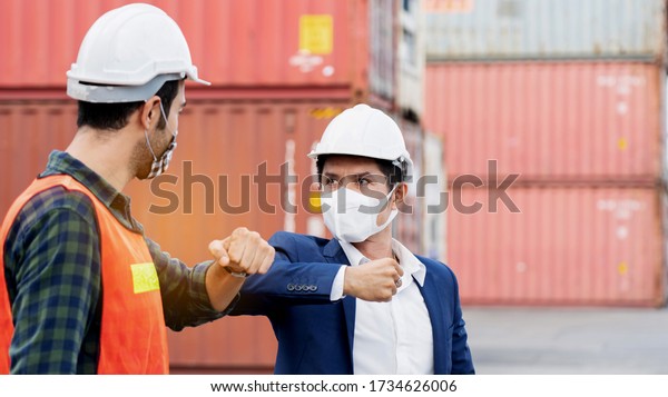 Construction Worker Engineer Greeting Bumping Elbows Stock Photo ...