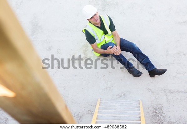 Construction Worker Falling Off Ladder Injuring Stock Photo 489088582 ...