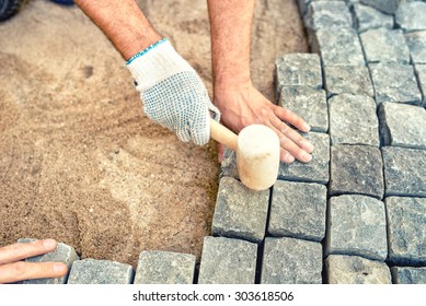 Construction Worker Installing Stone Blocks Creating Stock Photo ...