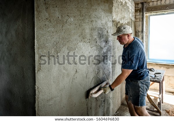 Construction Worker Plastering Wall Leveler Stock Photo 1604696830 ...