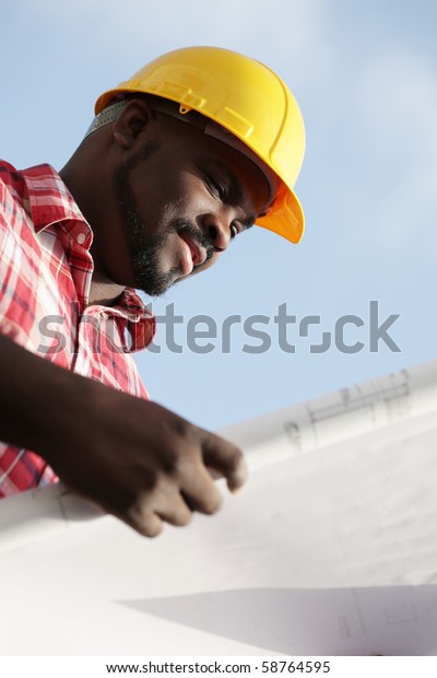 Construction Worker Reading Plans Outside Stock Photo (Edit Now) 58764595