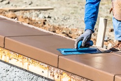 Worker using cement trowel featuring construction, construction site ...