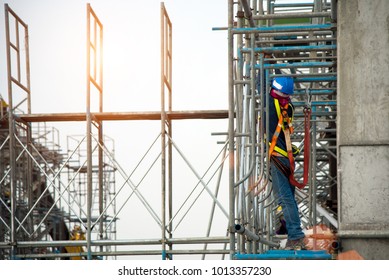Construction Worker Working On Scaffolding Construction Stock Photo ...