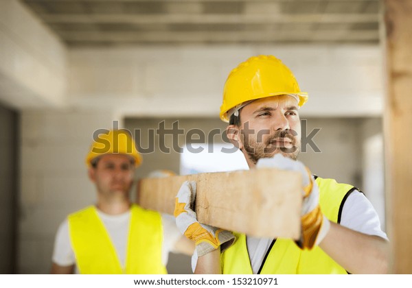 Construction Workers Collaborating On New House Stock Photo 153210971 ...