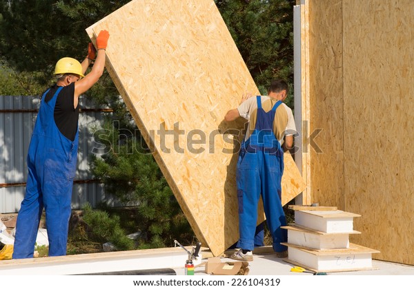 Construction Workers Positioning Timber Wall Panels Stock Photo ...