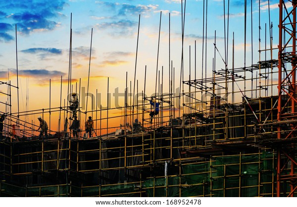 Construction Workers Sunset Stock Photo (Edit Now) 168952478