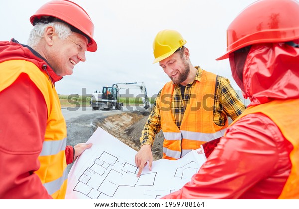 Construction Workers Team Floor Plan During Stock Photo 1959788164 ...