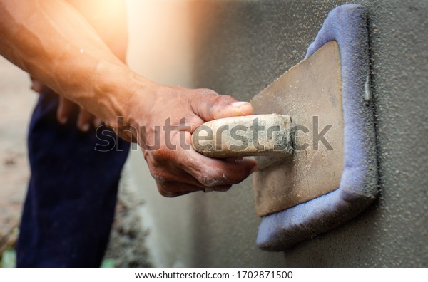 Construction Workers Using Sponges Plastering Trowels Stock Photo ...