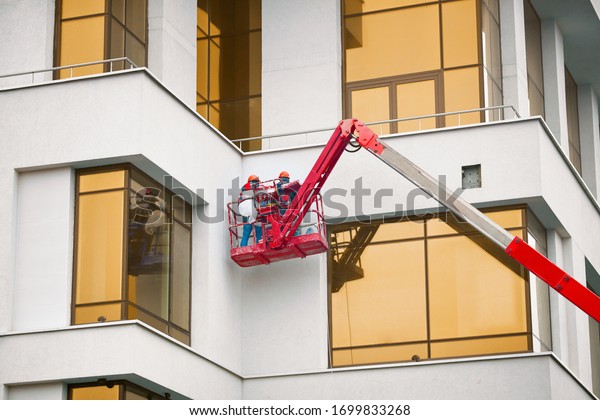 Construction Workers Working Height Lifting Bucket Stock Photo ...