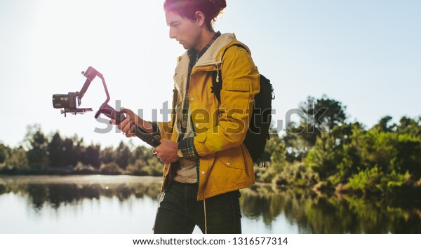 Photo de stock Le créateur de contenu filme une 1316577314 | Shutterstock