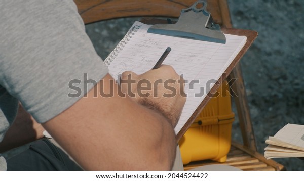 Crop Archaeologist Making Notes On Clipboard Stock Photo 2044524422 ...