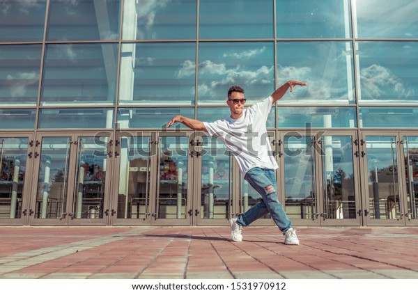 Dancer in motion dancing break dance, hip hop. In summer city ...