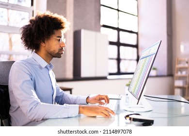 Data Analyst African Man Using Spreadsheet Stock Photo 2114897078 ...